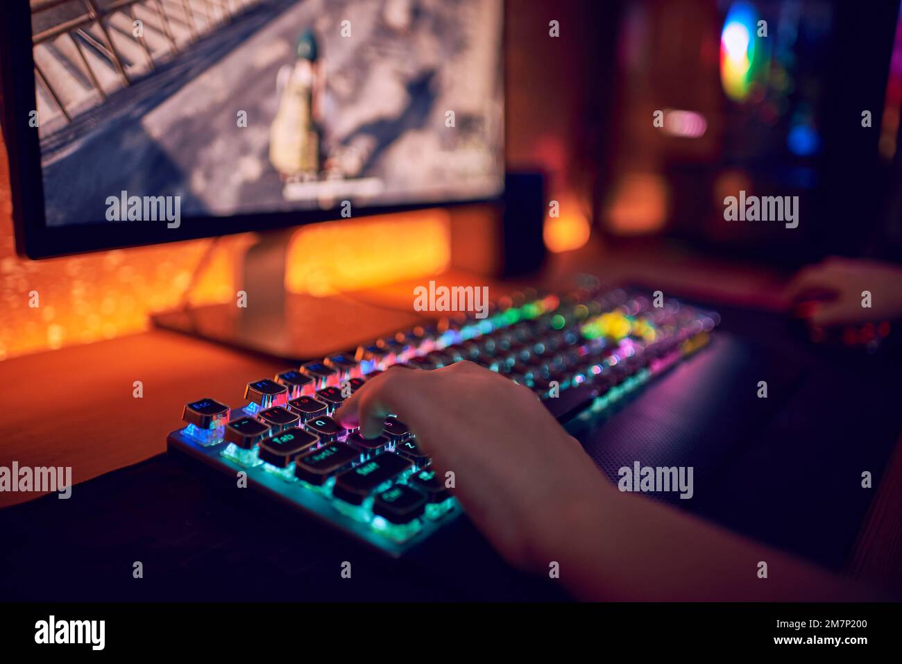Close Up Hands Shot Showing a Gamer Pushing the Keyboard Buttons while ...