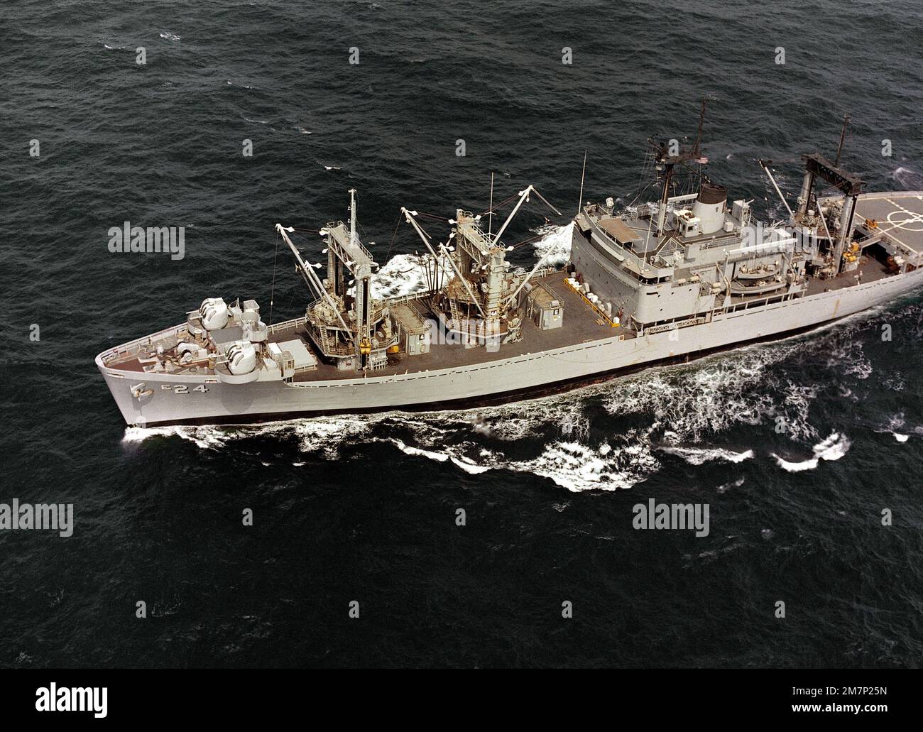 A partial port view of the ammunition ship USS PYRO (AE 24) underway ...