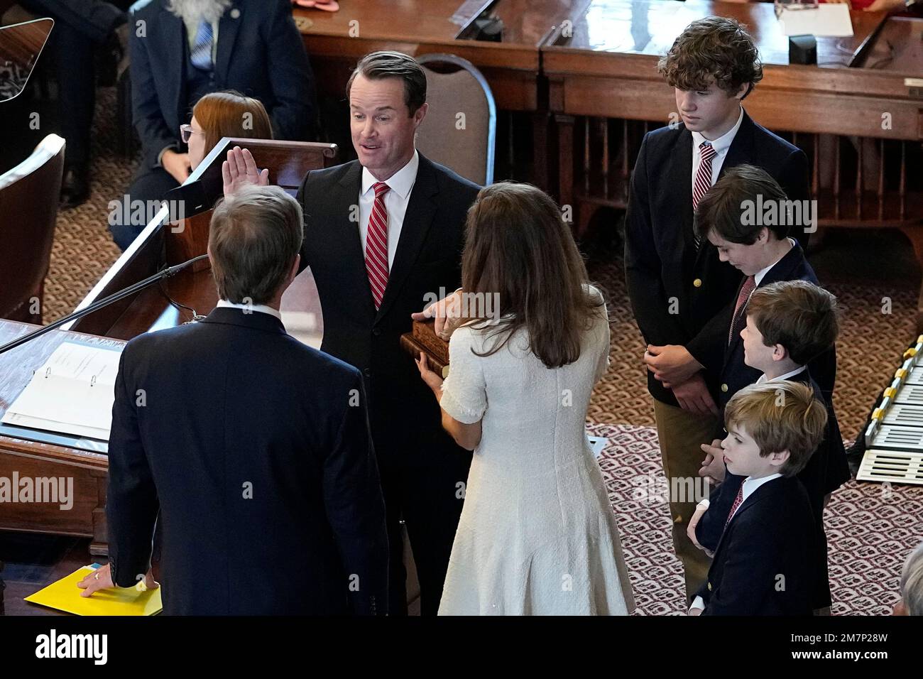 Speaker of the House Dade Phelan, R-Beaumont, center, stands with his ...
