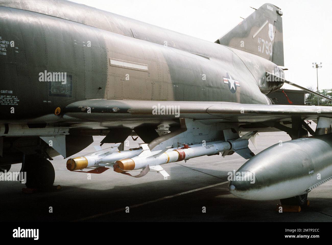 Two AIM -9P Sidewinder missiles mounted on the wing pylon of an F-4C ...