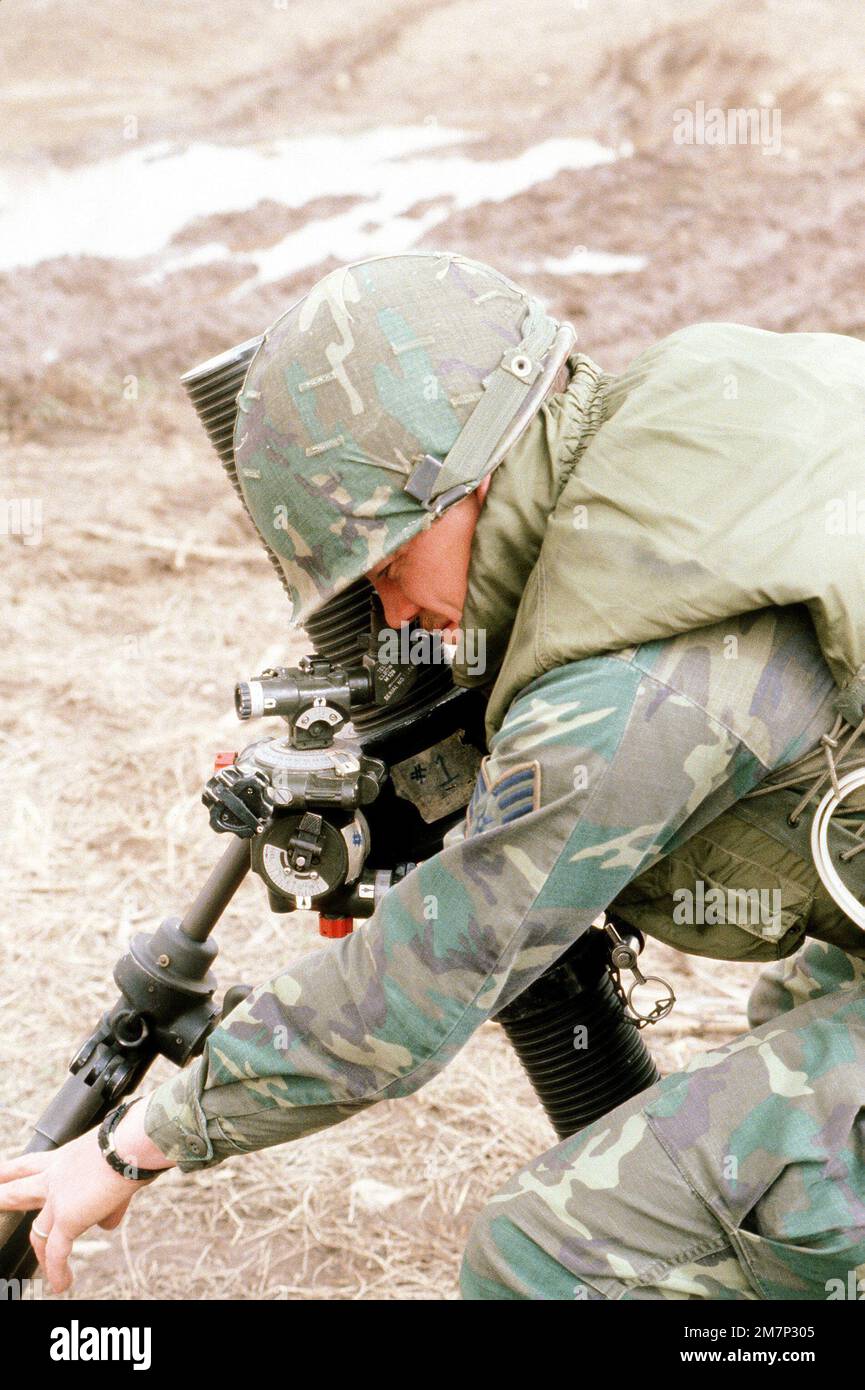 Security policeman SGT Robert Colyer aims an M-29 81mm mortar during ...