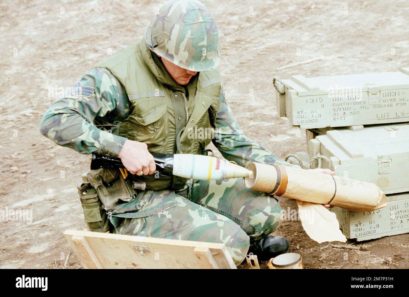 51st Security Police Squadron member SSGT Robert Colyer packs a white ...