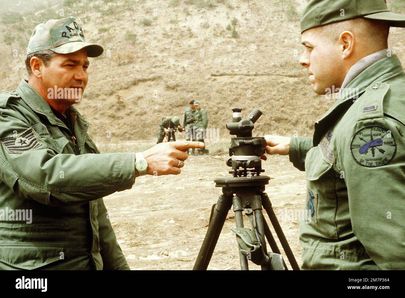 MASTER SGT. Arvel Jackson instructs 1ST LT. Vance Zider on the use of a ...
