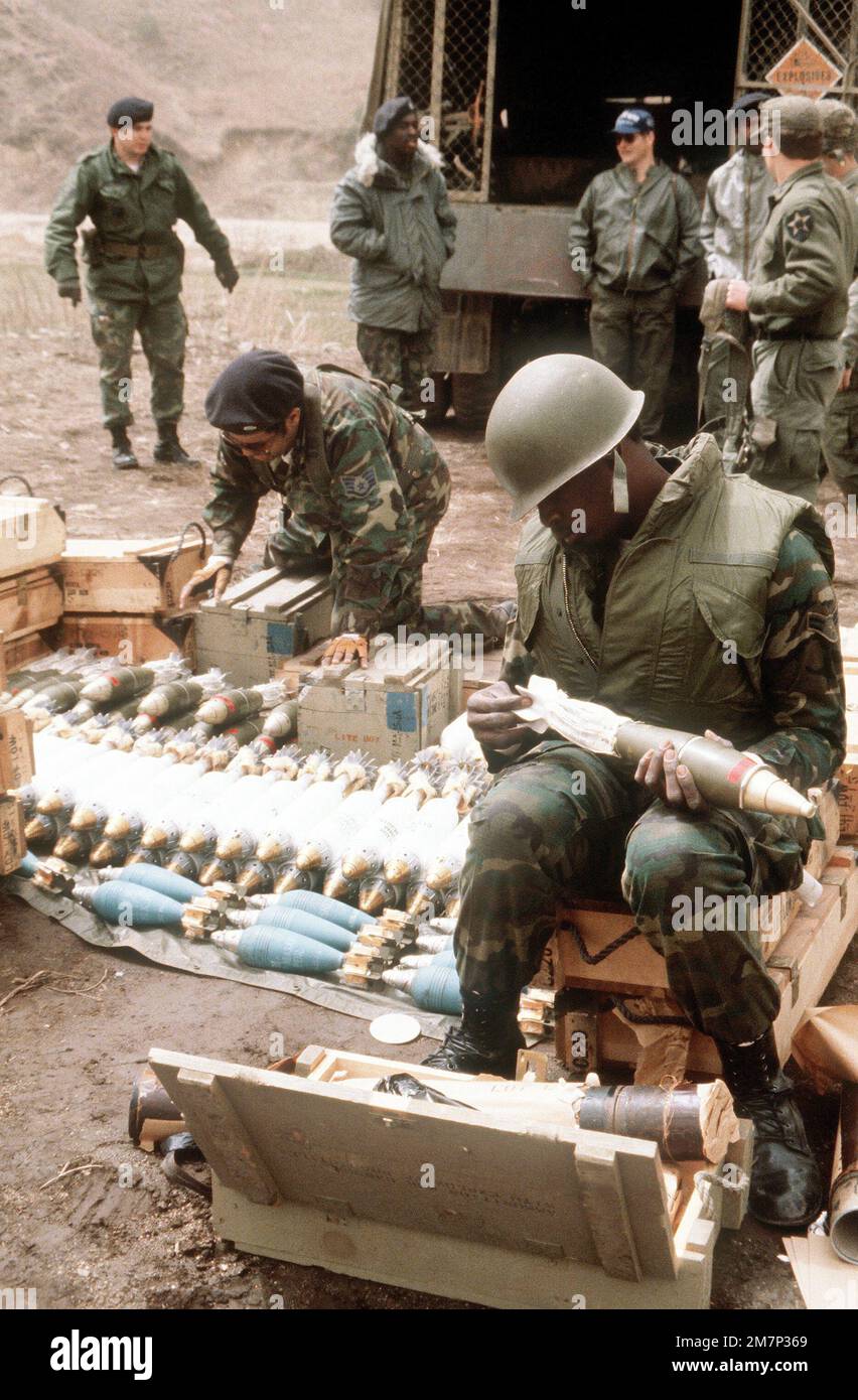 Security policemen set charges on mortar rounds during heavy weapons ...