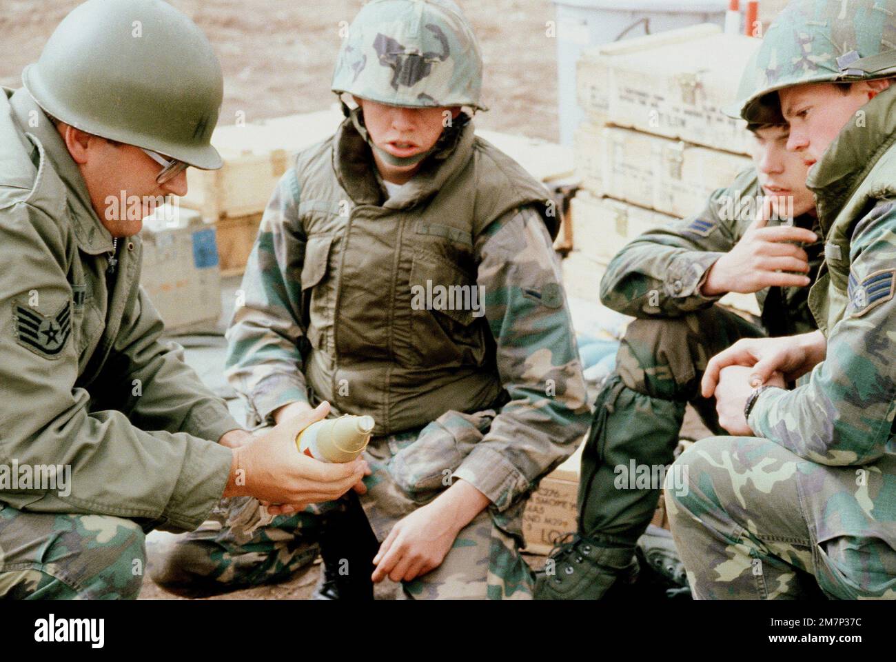 SSGT Craig Harvey explains the use of a white phosphorous mortar round ...