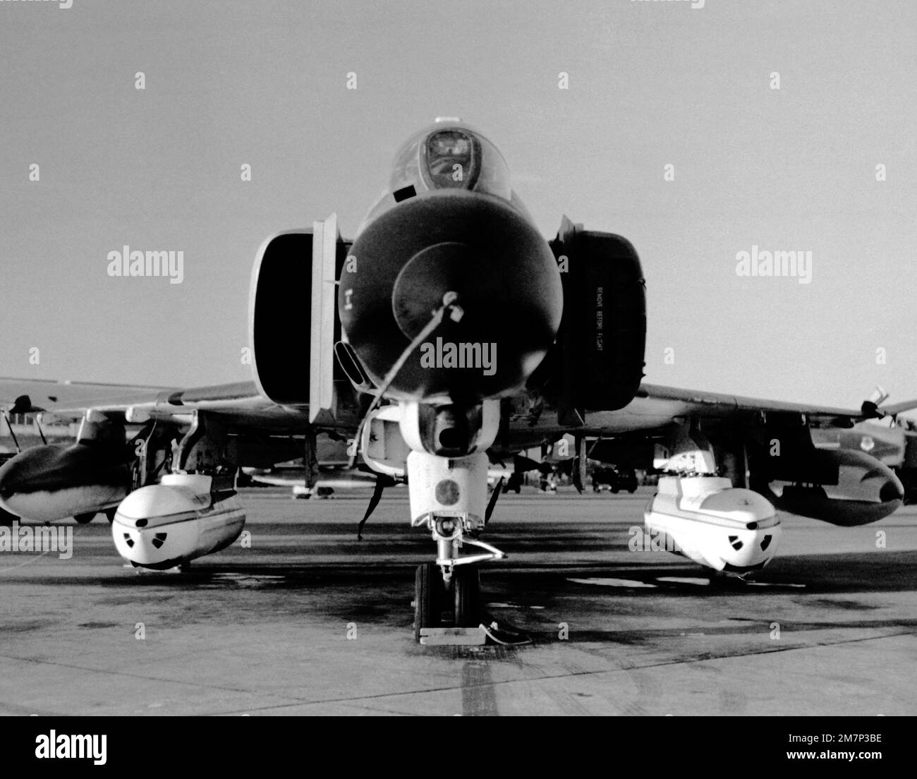 A view of an F-4E Phantom II aircraft parked on the flight line. The F ...