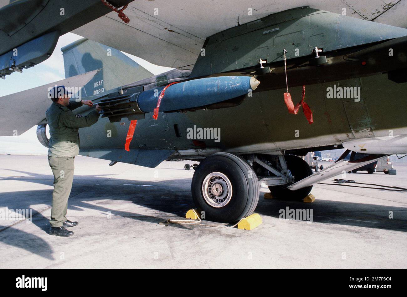 A Mark 82 500-pound high drag bomb is loaded onto an FB-111A aircraft ...
