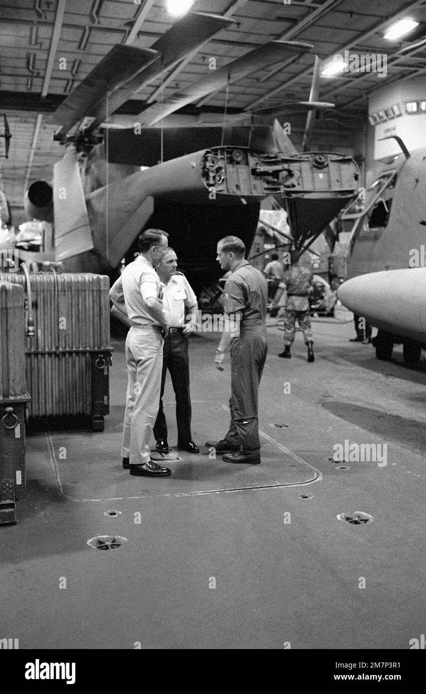 Officers in the hangar bay of the nuclear-powered aircraft carrier USS ...