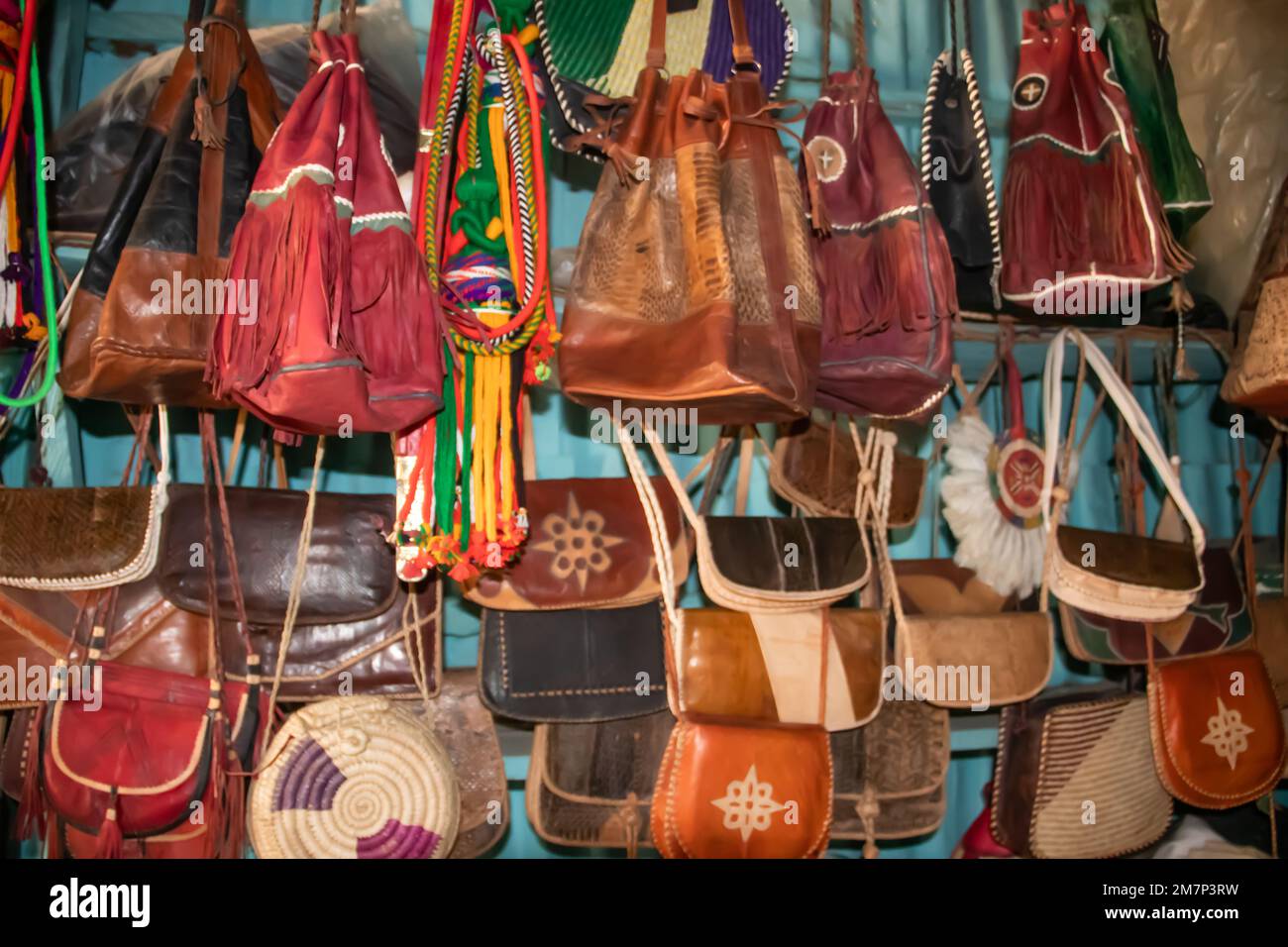 African local souvenir shop with colorful necklaces, leader bags ...