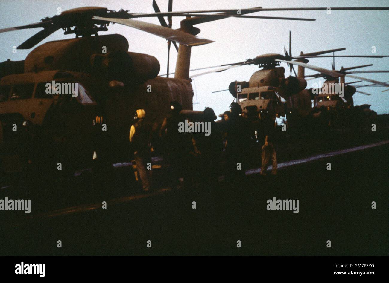RH-53 Sea Stallion helicopters line the flight deck of the nuclear ...