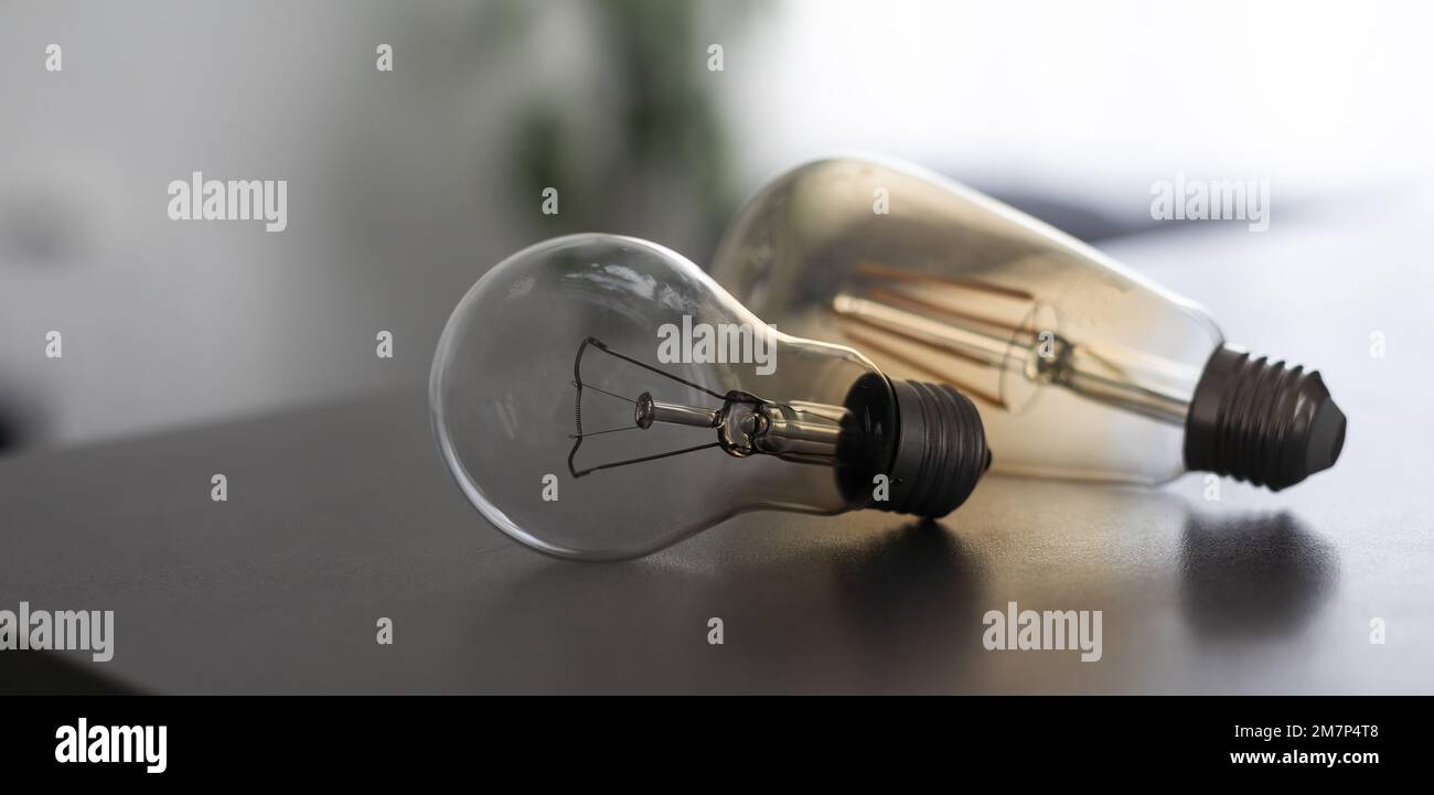 Alternative technology concept . Bulb and Fluorescent bulb comparing ...