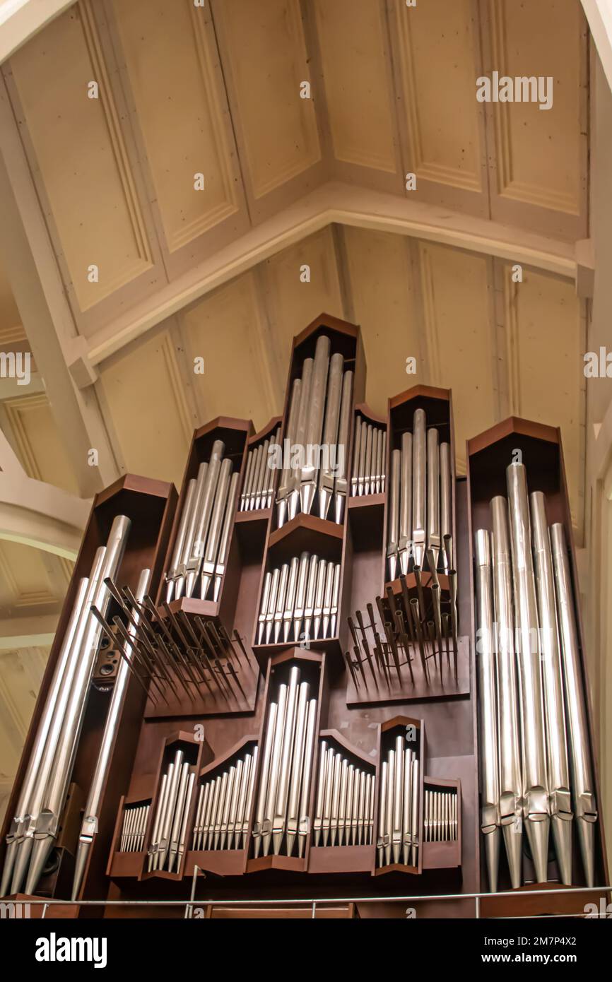 Church pipe organ instrument made of metal and wood, in Catholic church ...