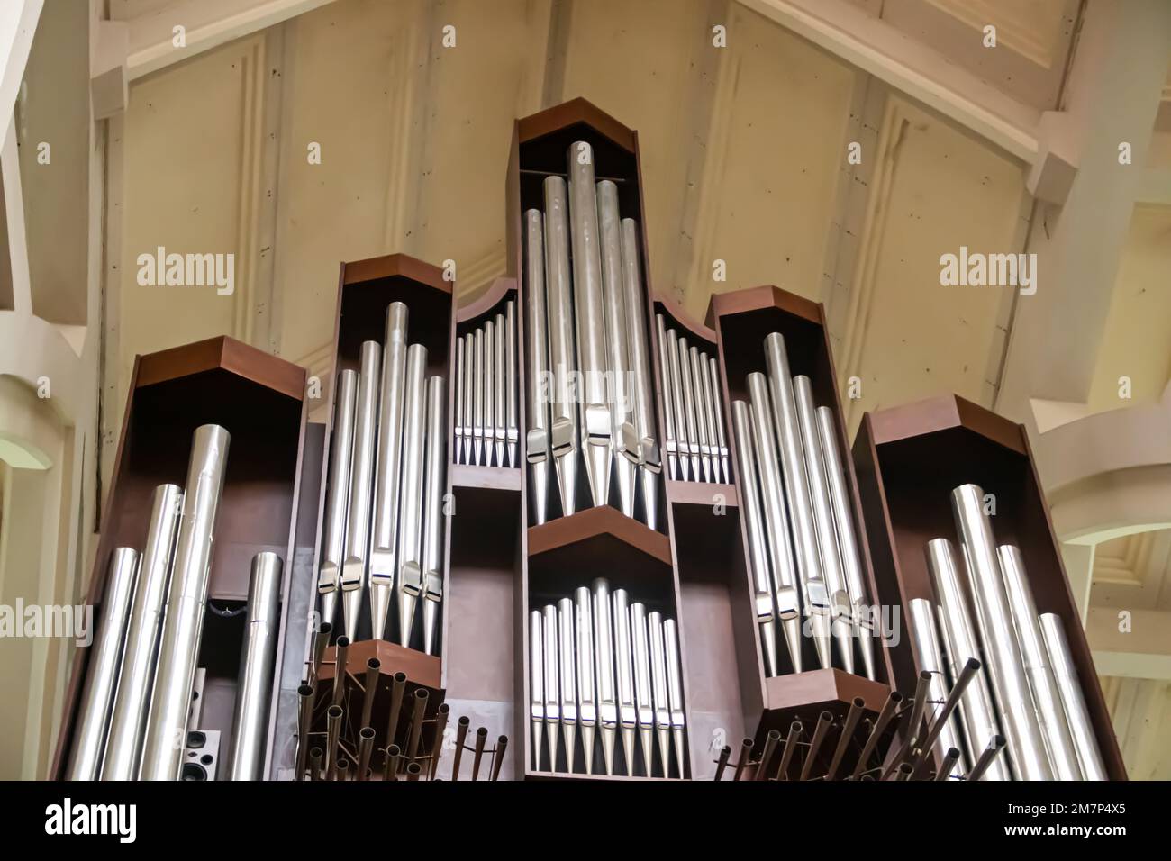 Church pipe organ instrument made of metal and wood, in Catholic church ...