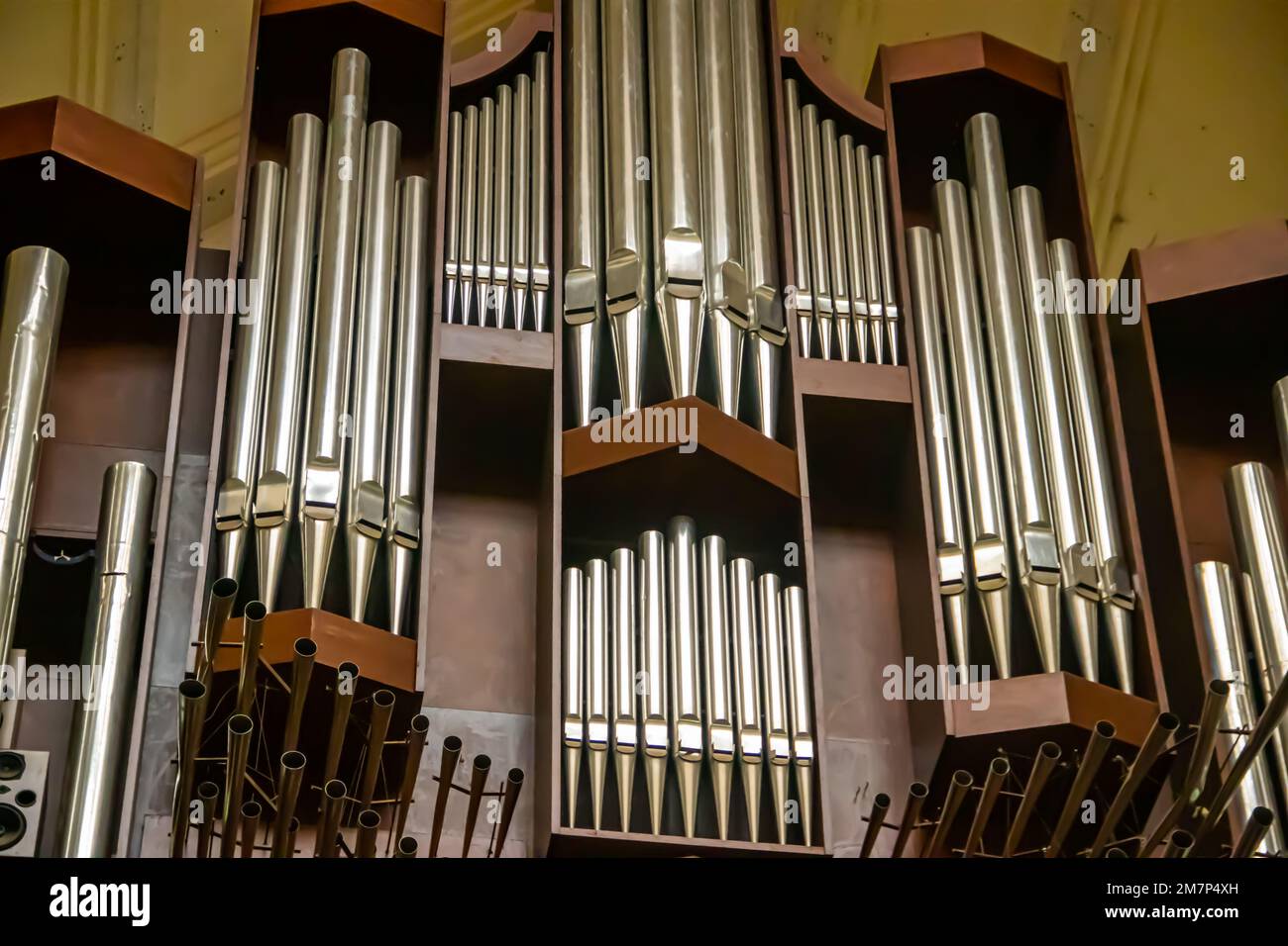 Church pipe organ instrument made of metal and wood, in Catholic church ...