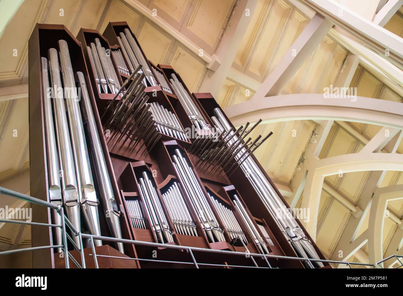 Church pipe organ instrument made of metal and wood, in Catholic church ...