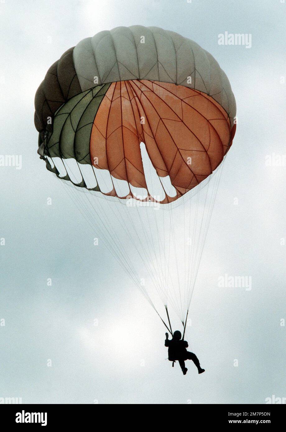 An American jumper floats down after jumping from a C-130 Hercules ...