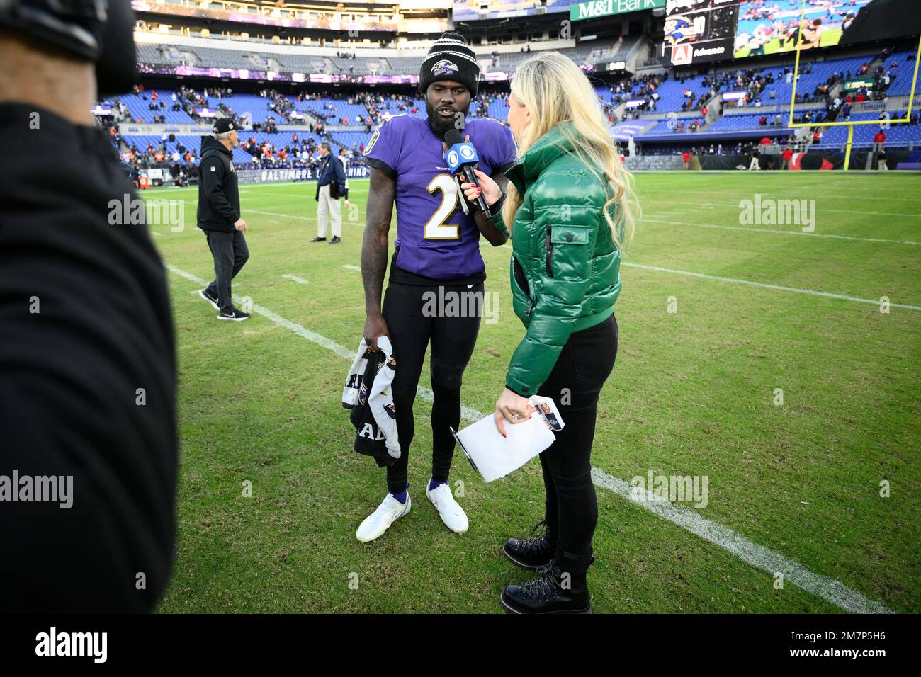 CBS sports sideline reporter Melanie Collins, right, talks with ...