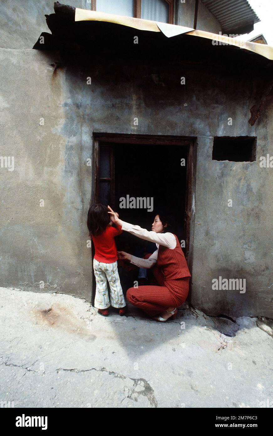 Ms. Tae Sun Pak (left), a social worker employed by the Osan Air Base ...