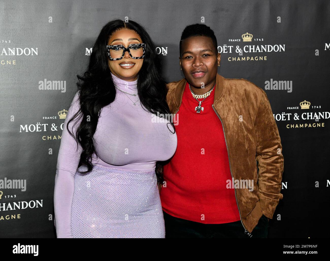 Sam Jay, right, and wife Yanise Monet attend the Moet & Chandon holiday season celebration at ...