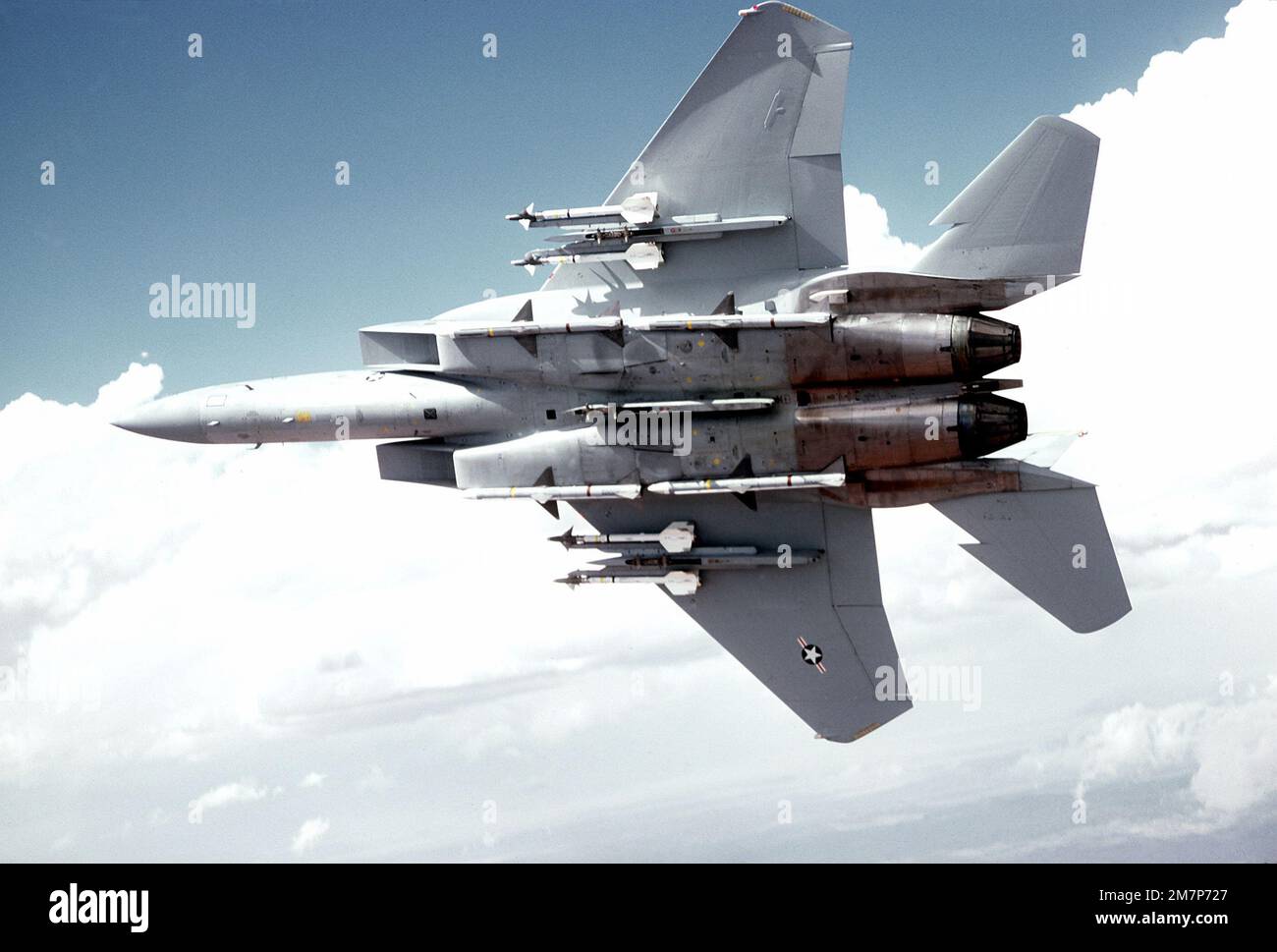 Bottom view of an F-15 Eagle aircraft armed with AIM-9 Sidewinder and ...