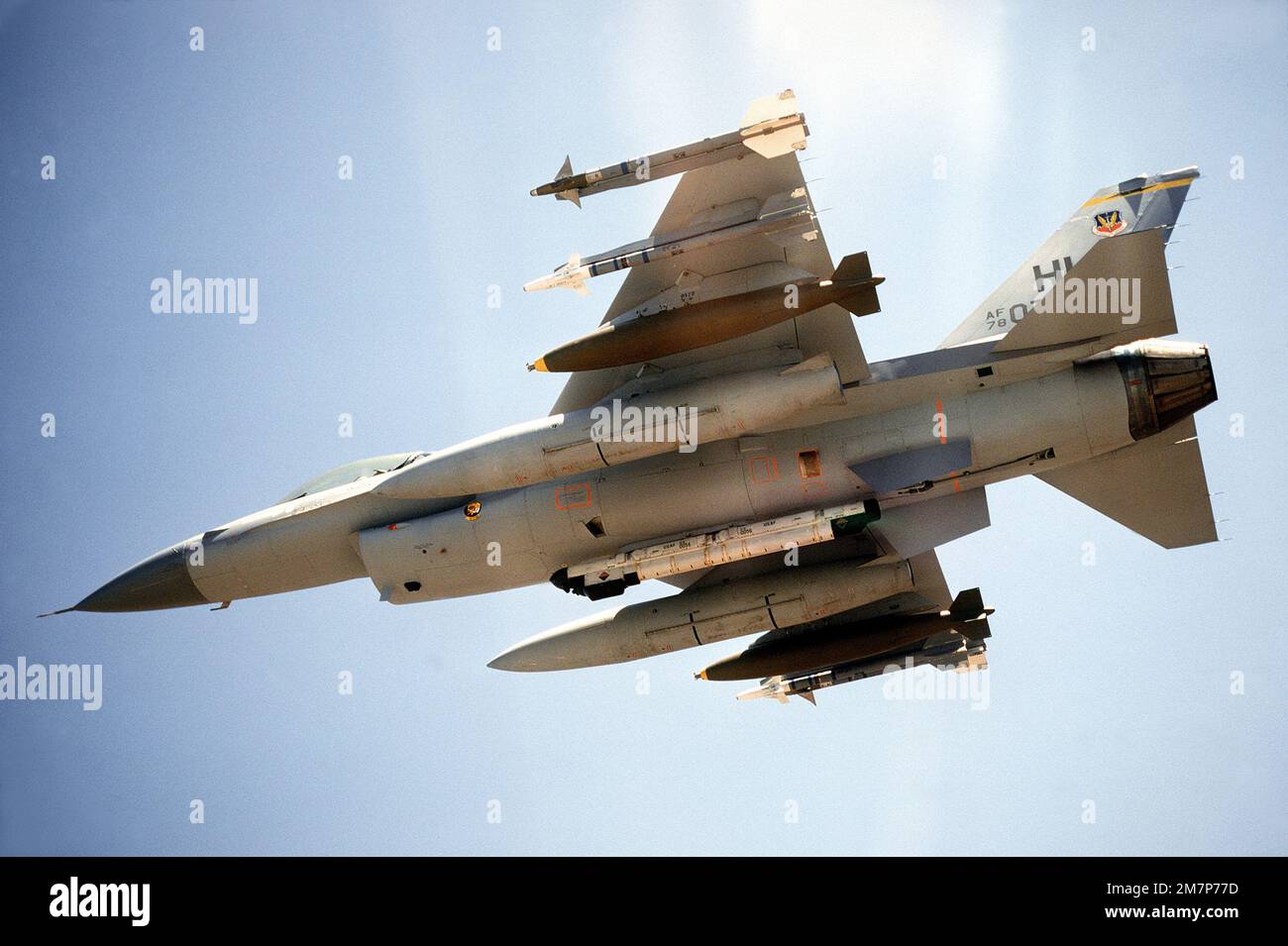 AN air-to-air view of the underside of an F-16 Fighting Falcon aircraft ...