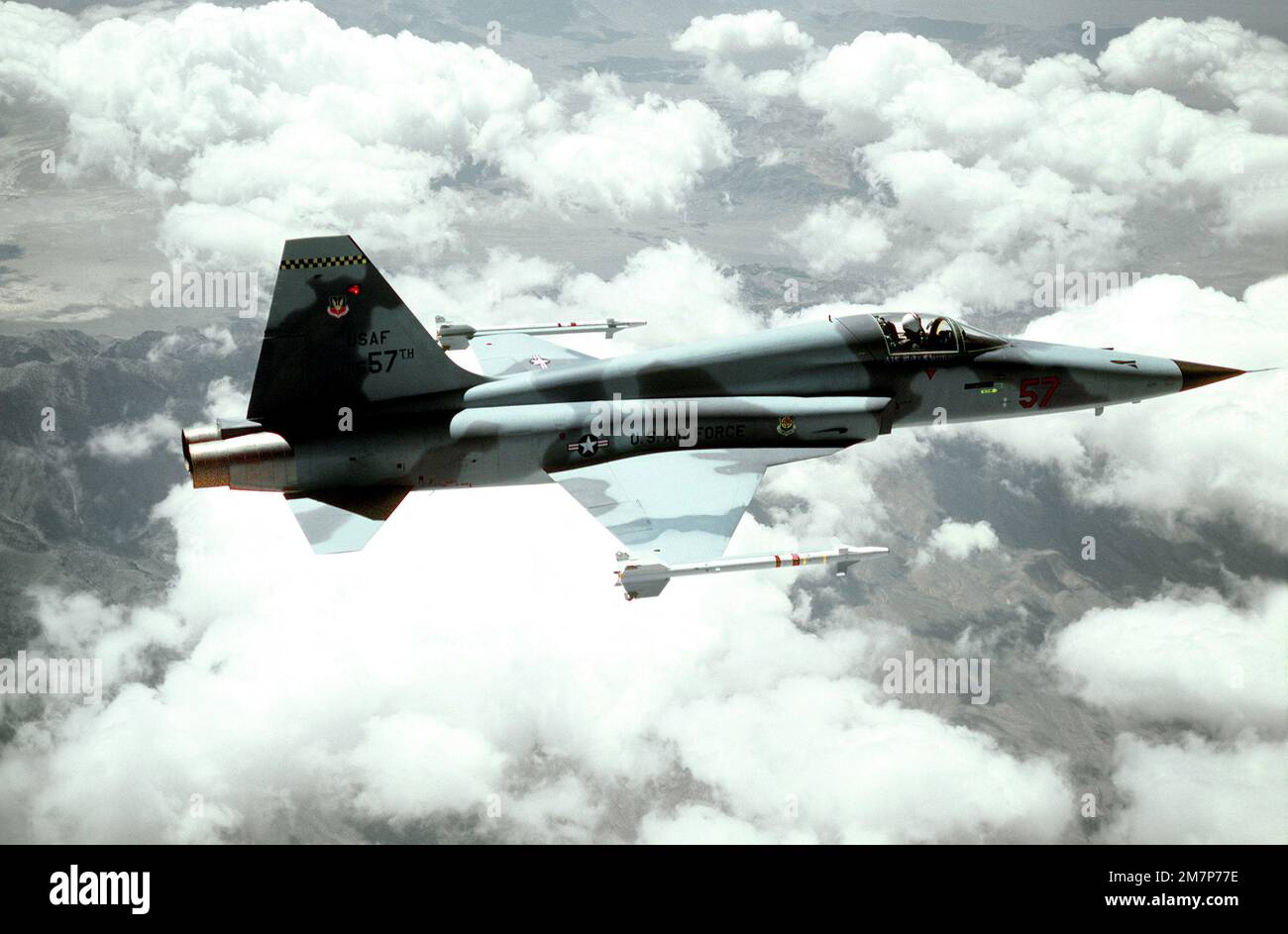 AN air-to-air right rear view of the F-5 Tiger II aircraft over a range ...