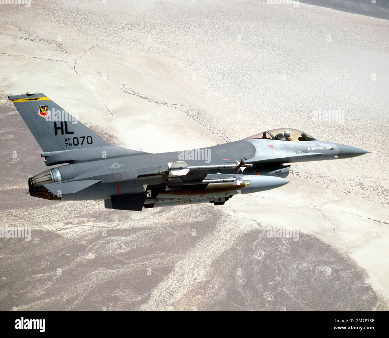 AN air-to-air right side view of an F-16 Fighting Falcon aircraft ...