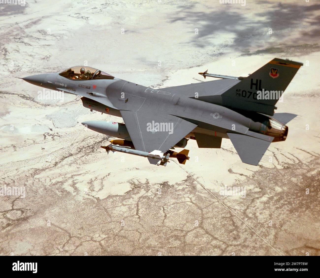 AN air-to-air left rear view of an F-16 Fighting Falcon aircraft in ...