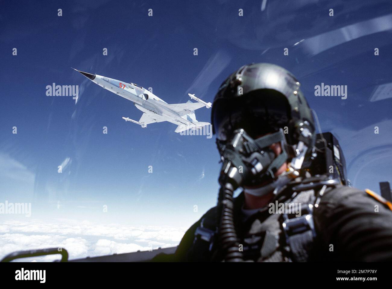 A close-up view of an F-15 Eagle aircraft backseater over a range, with ...