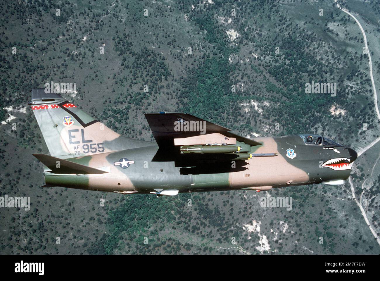 AN air-to-air right side view of an A-7D Corsair II aircraft over a ...