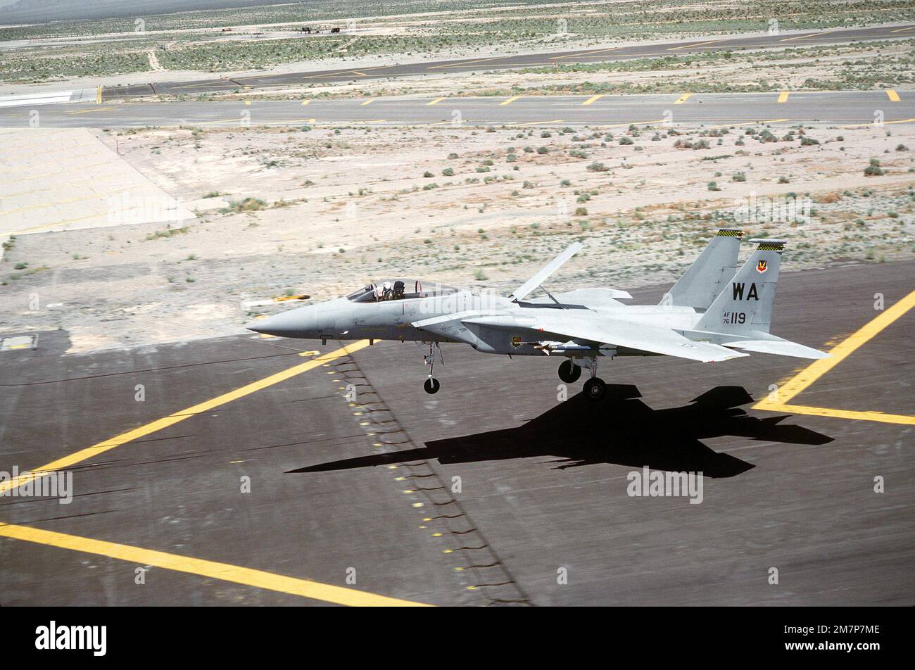 A left front view of an F-15 Eagle aircraft landing with the speed ...