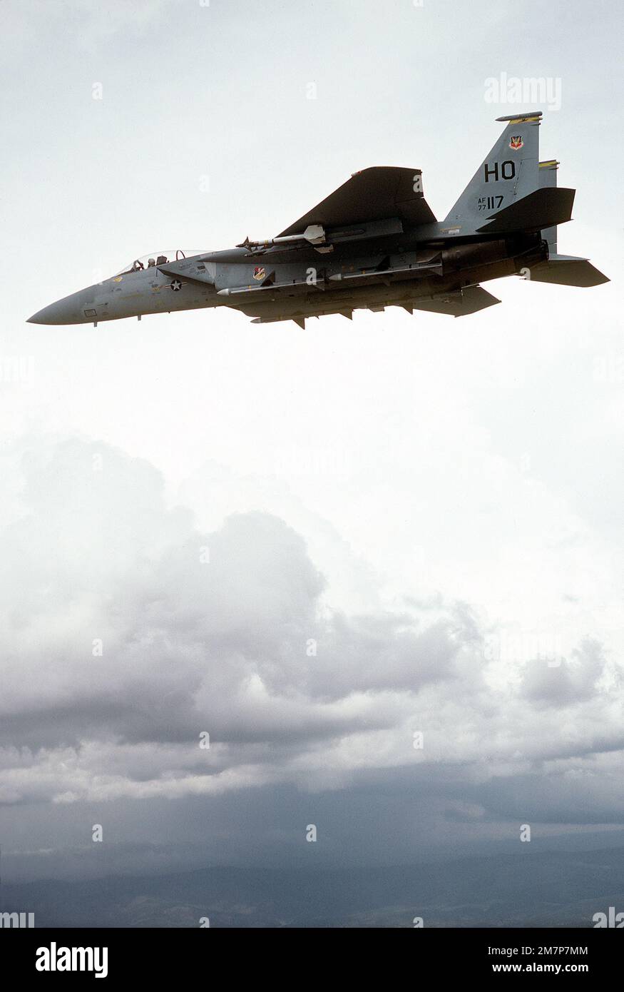 AN air-to-air left side view of an F-15 Eagle aircraft in flight over ...
