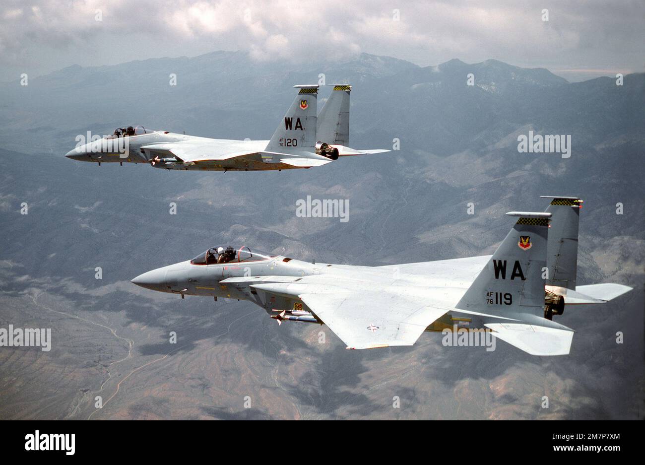 AN air-to-air left side view of two F-15 Eagle aircraft returning from ...
