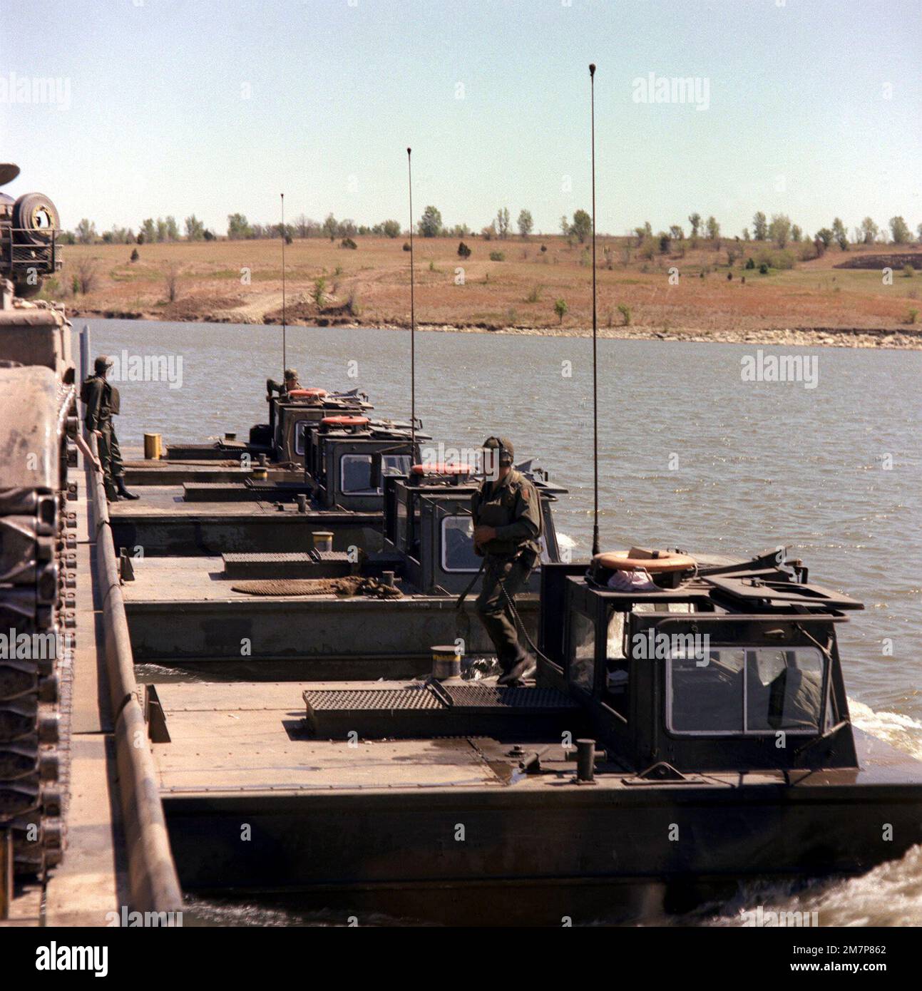 Members of Company E, 1ST Engineer Battalion transport tanks across a ...