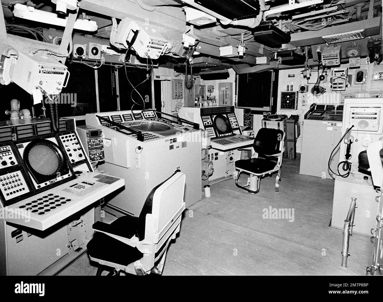 An interior view of the combat information center on the guided missile ...