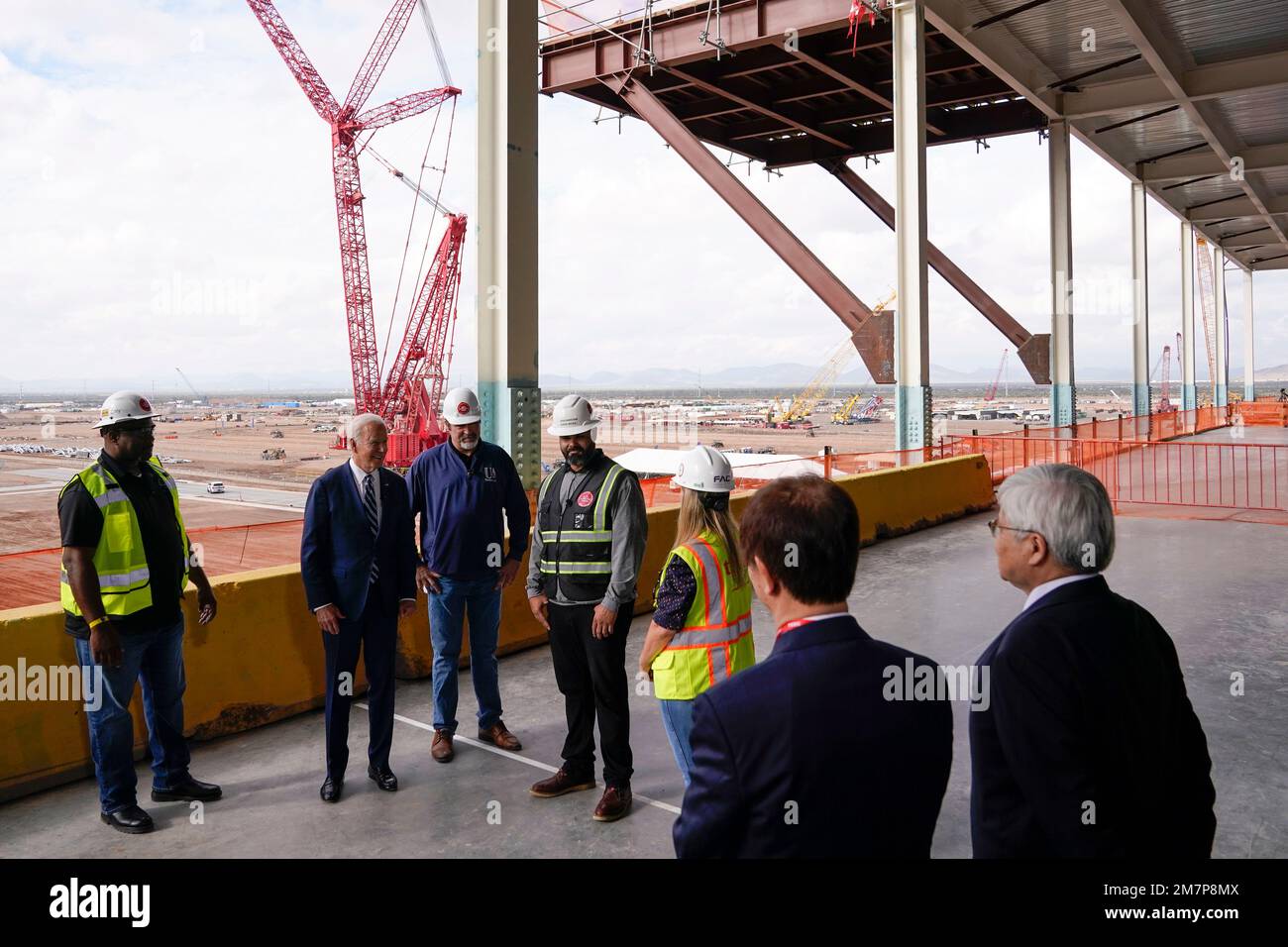 President Joe Biden tours the building site for a new computer chip ...