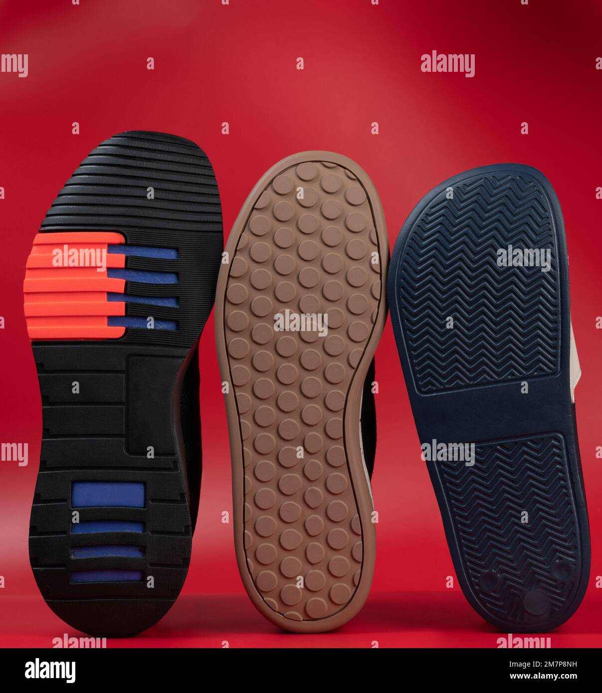 Different shoes sole print isolated on red studio background Stock ...