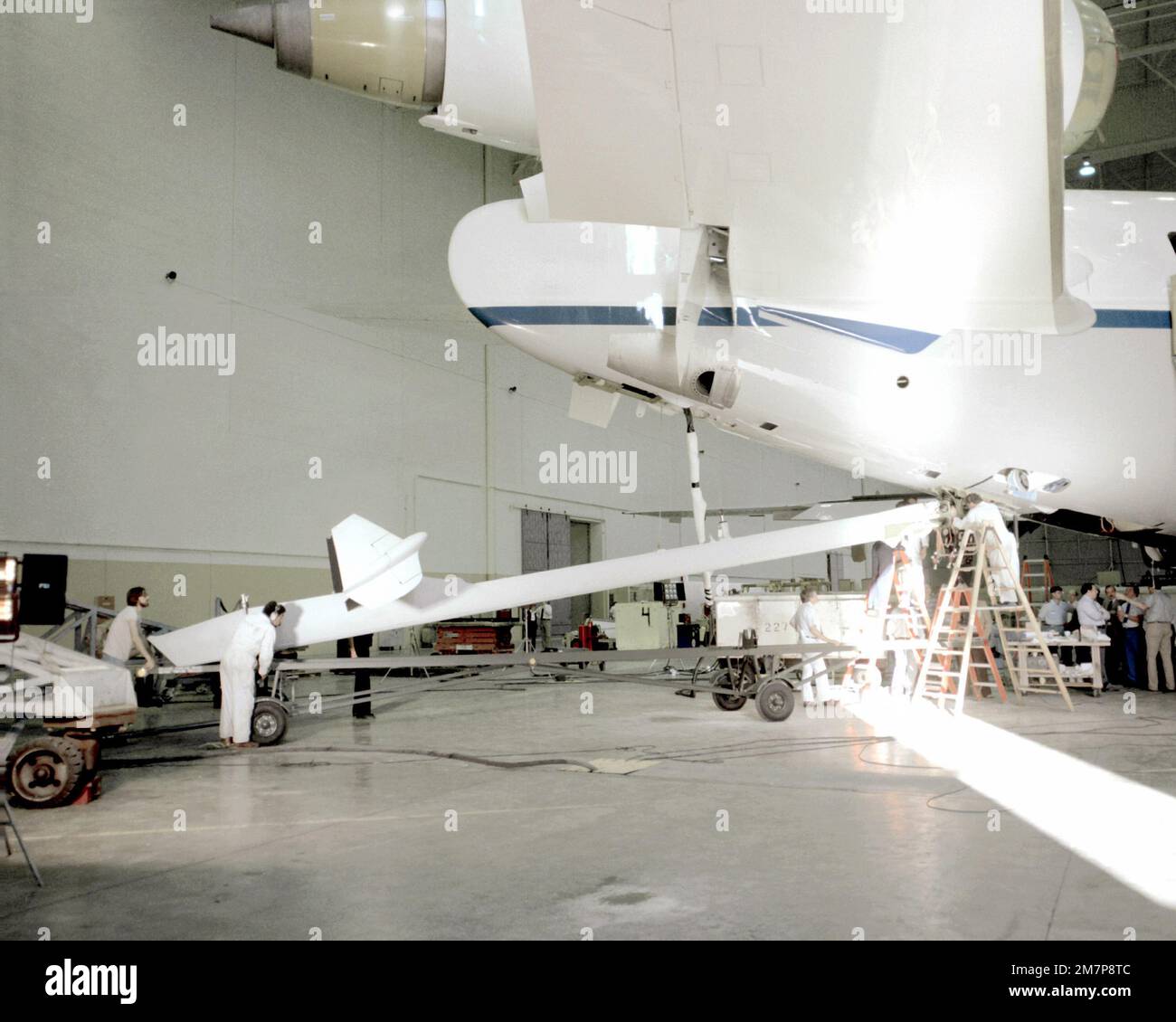 A refueling boom is being installed on a newly-built KC-10 Extender ...
