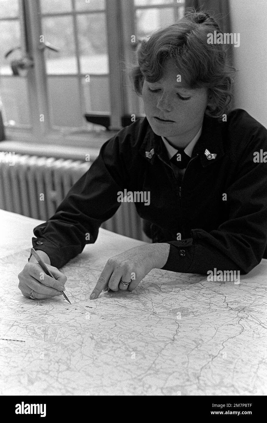 SGT. Debbie S. Stroud, graphics specialist, applies the tape to mark a ...