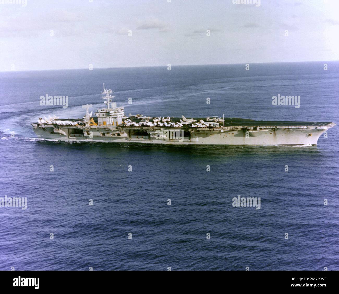 A starboard bow view of the nuclear-powered aircraft carrier USS NIMITZ (CVN-68) executing a ...