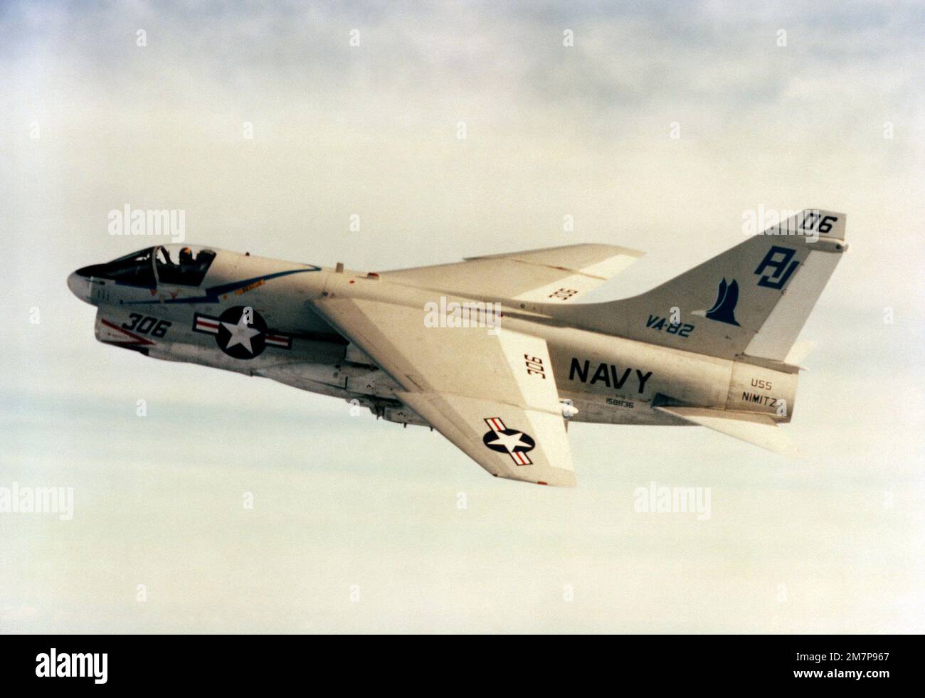 An air-to-air left side view of an A-7E Corsair II aircraft from Light ...