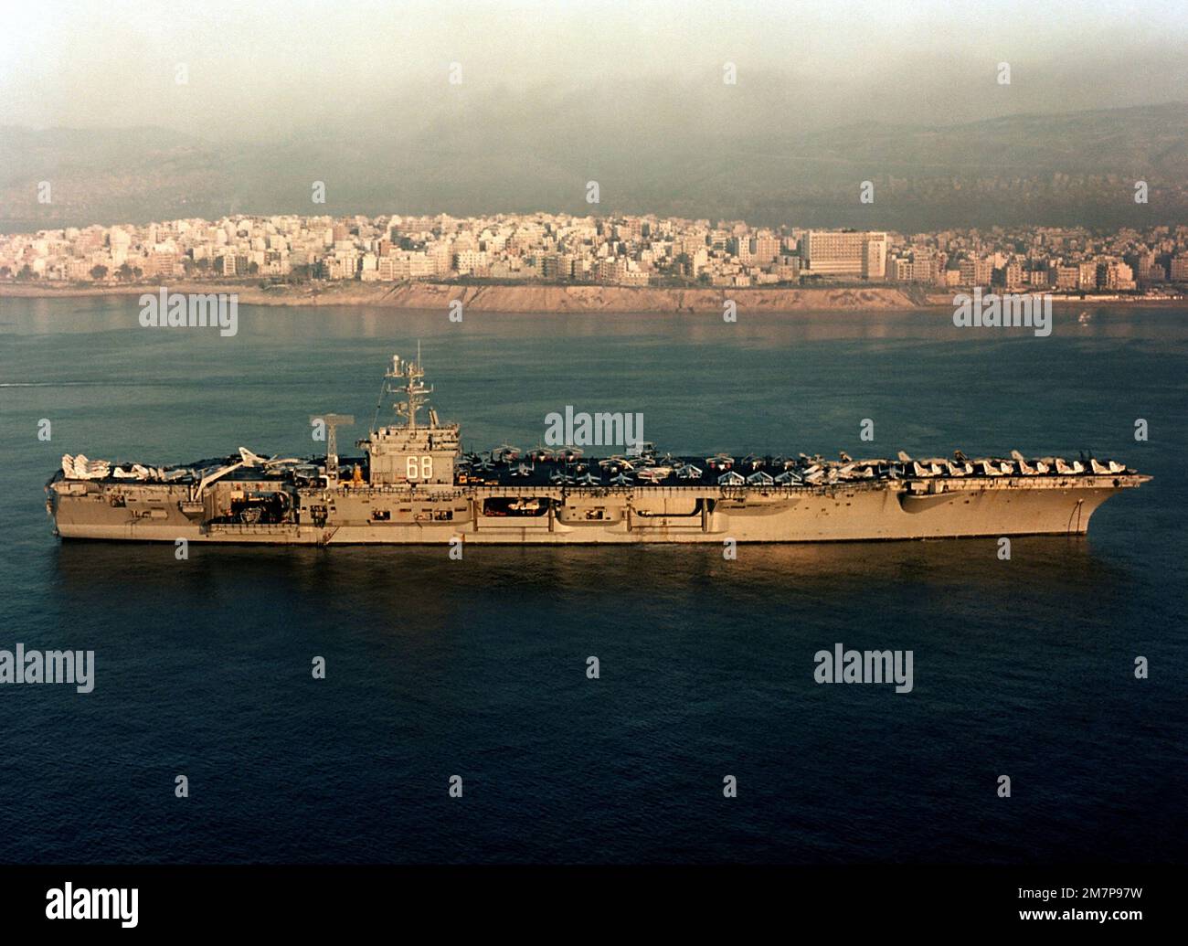 A starboard beam view of the nuclear-powered aircraft carrier USS NIMITZ (CVN 68). Country ...