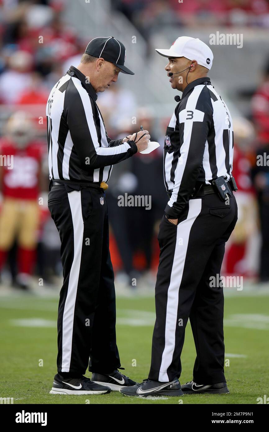 Referee Tra Blake (3) and umpire Tony Michalek (115) stand during an ...