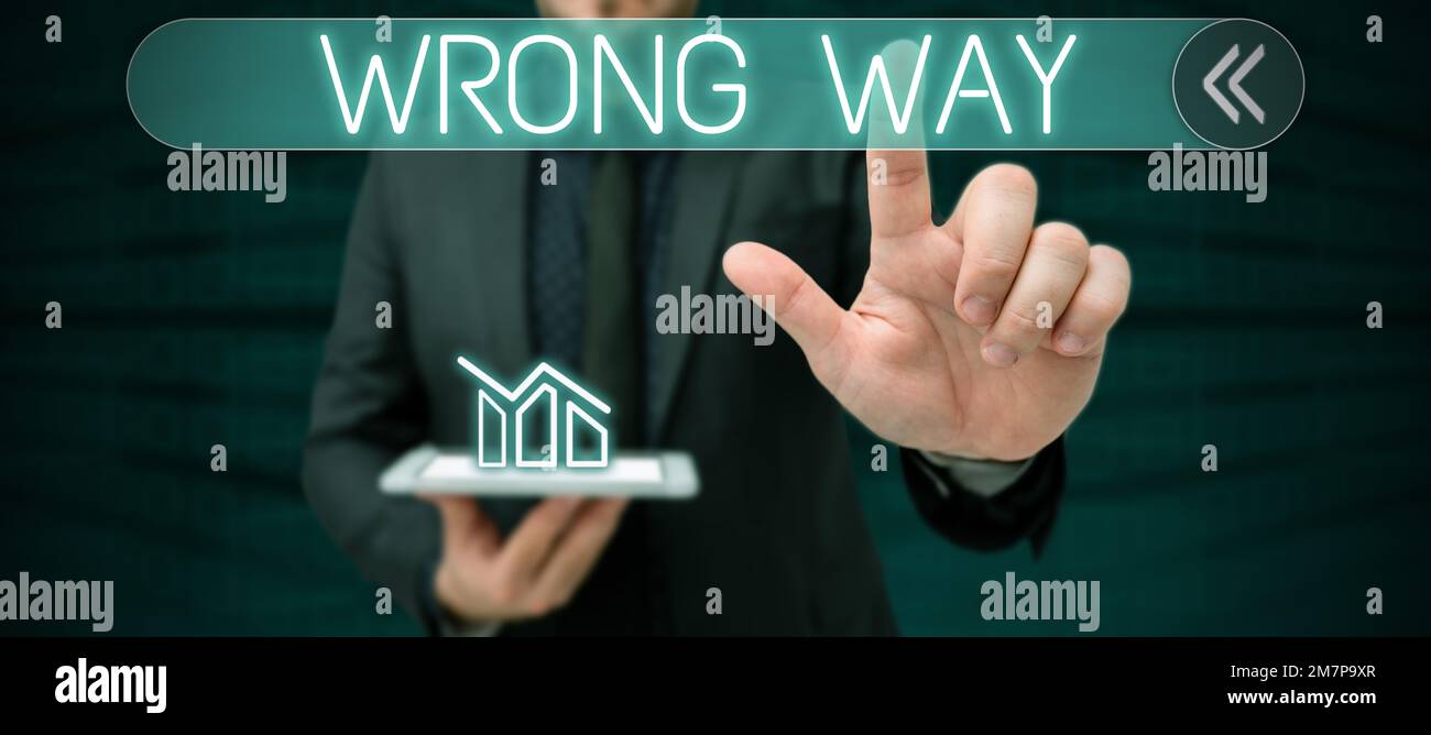 Hand writing sign Wrong Way. Concept meaning taking an unsuitable or ...