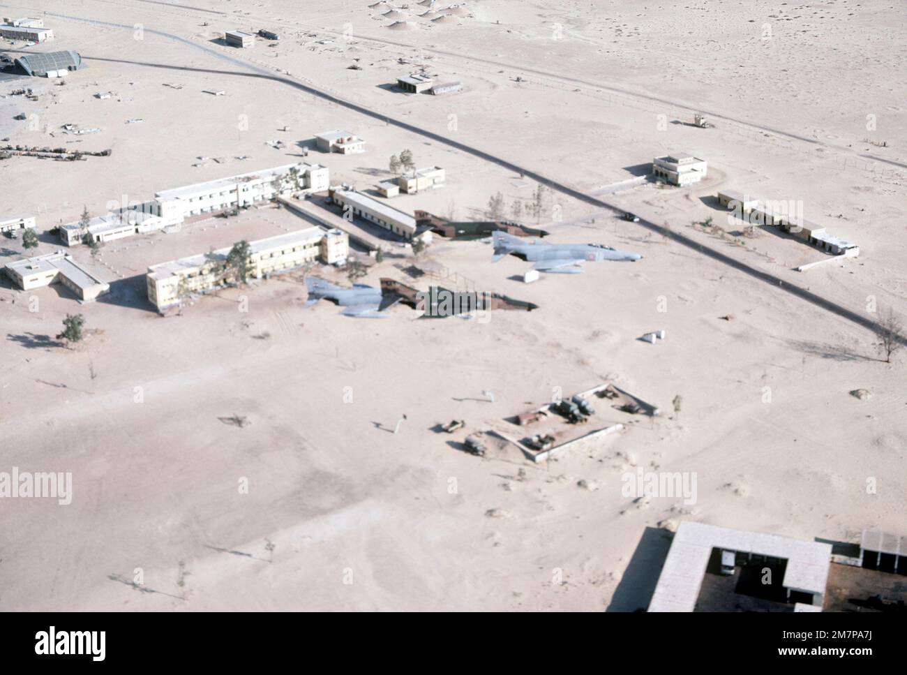 AN air-to-air right side view of four F-4E Phantom II aircraft flying ...