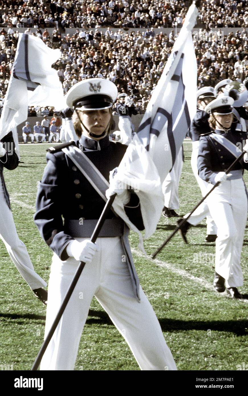 A female cadet carries a guidon during the graduation ceremony at the ...