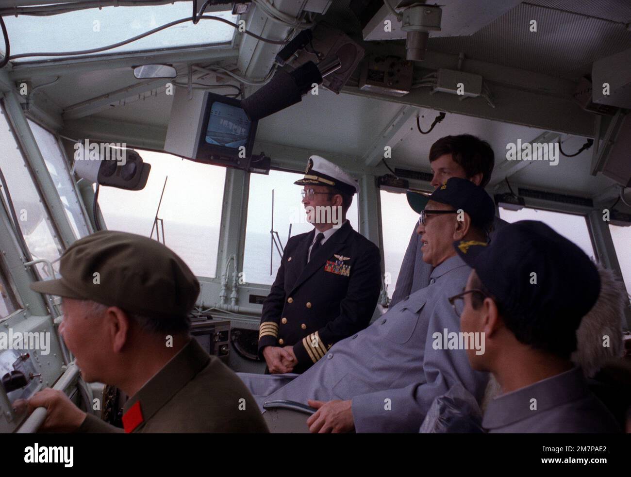 Vice Premier Geng Biao, People's Republic of China, sits in the captain ...