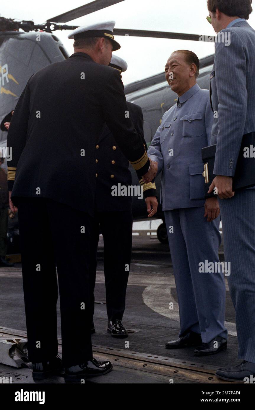 Vice Premier Geng Biao, People's Republic of China, is welcomed aboard ...