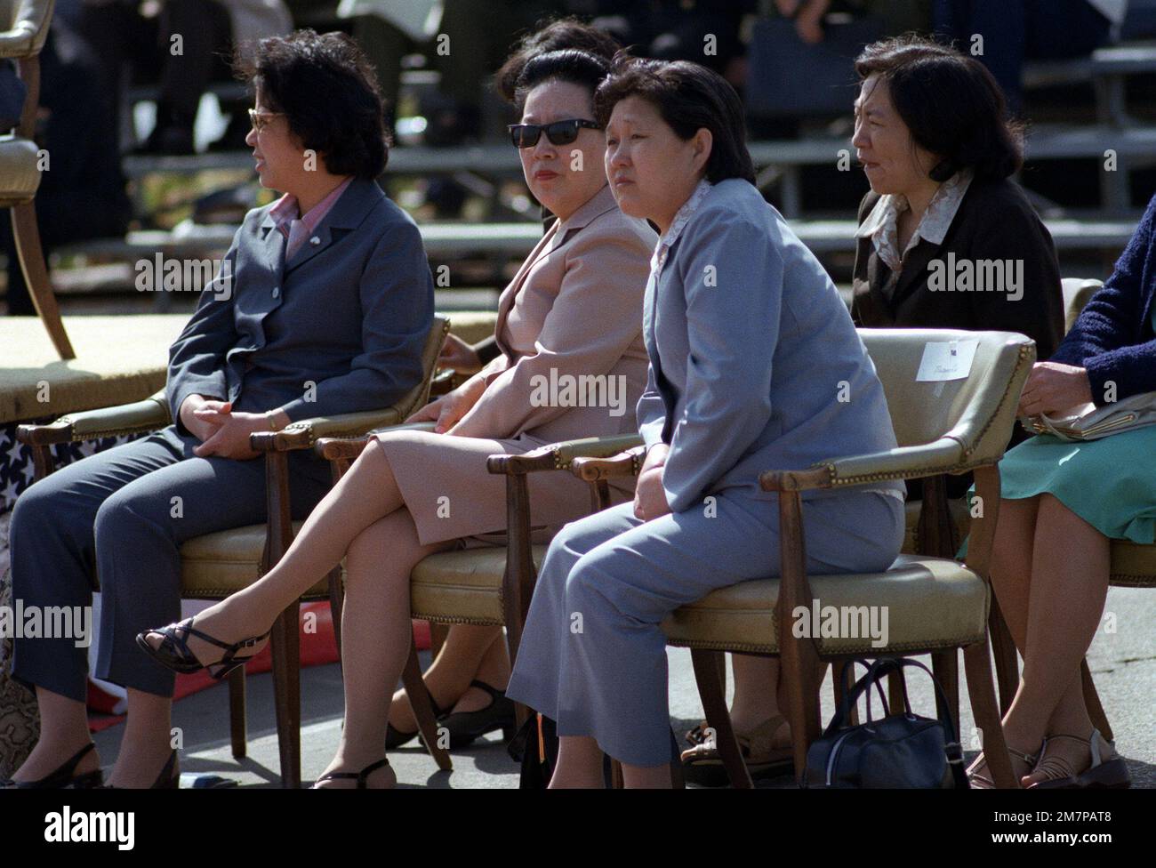 Wives of the members of the delegation from China watch an aerial ...
