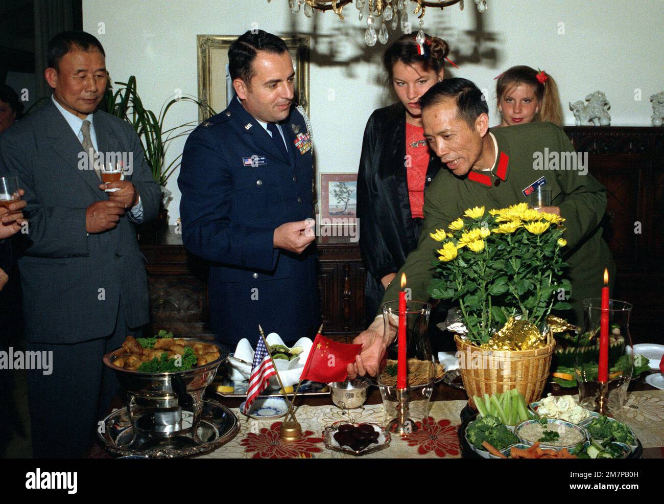 A member of the delegation from China has a discussion with an Army ...